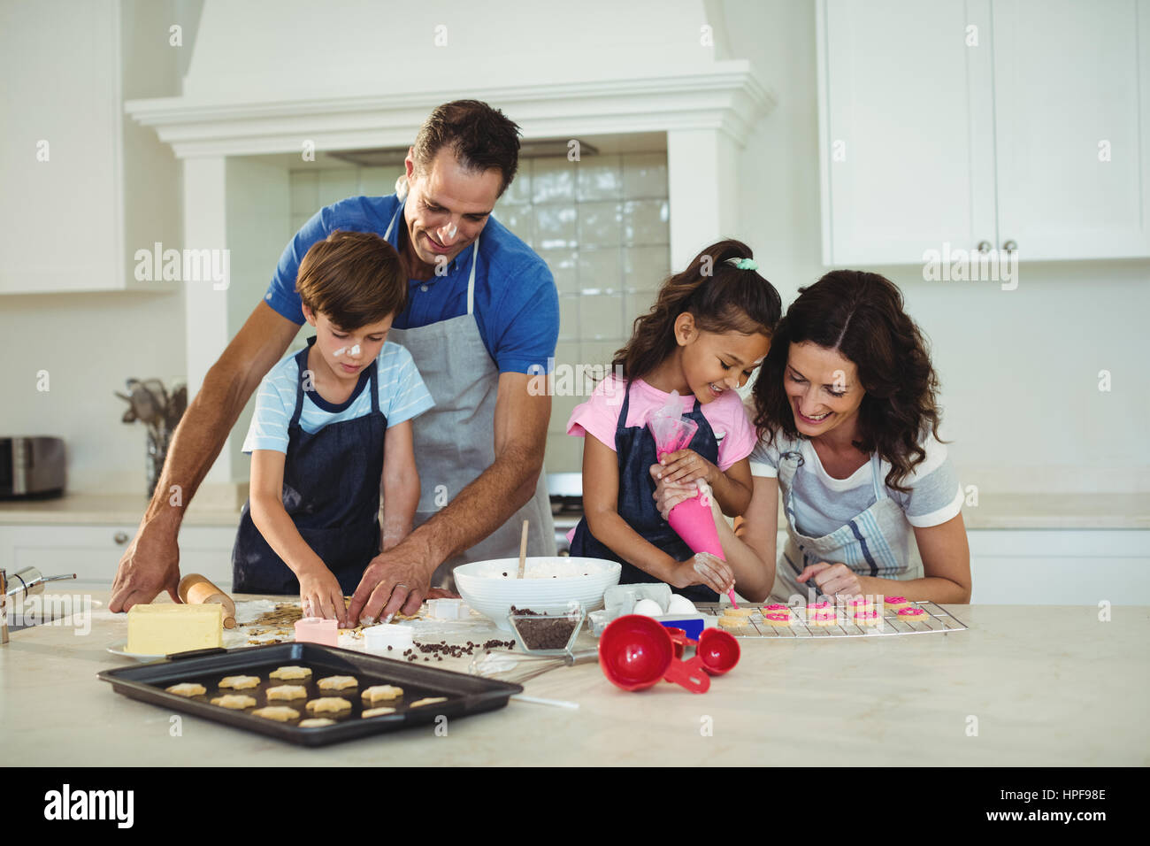 Boy mixing chocolate in kitchen hi-res stock photography and images - Alamy