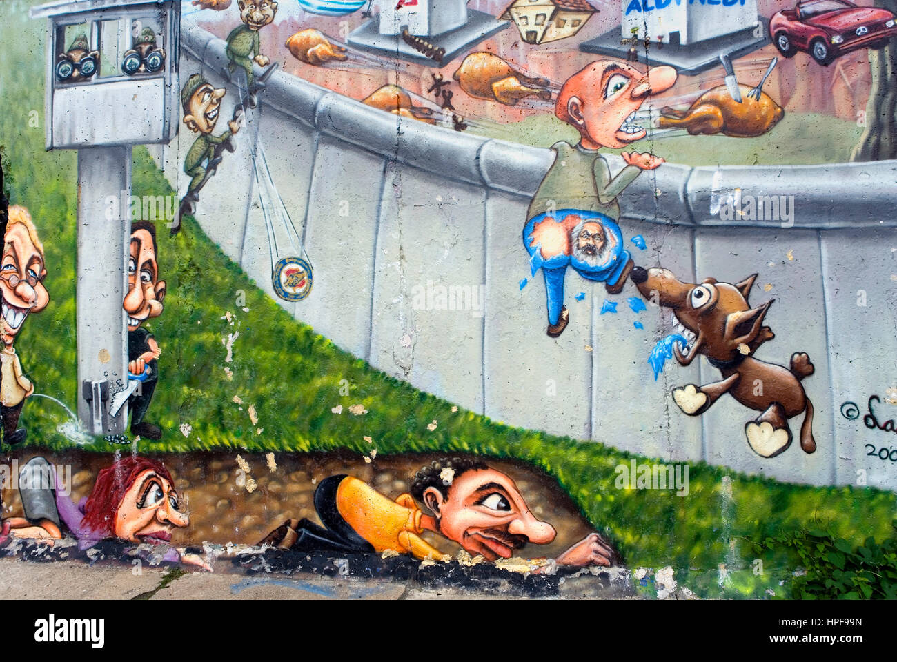 Graffiti art berlin wall cartoon hi-res stock photography and images ...
