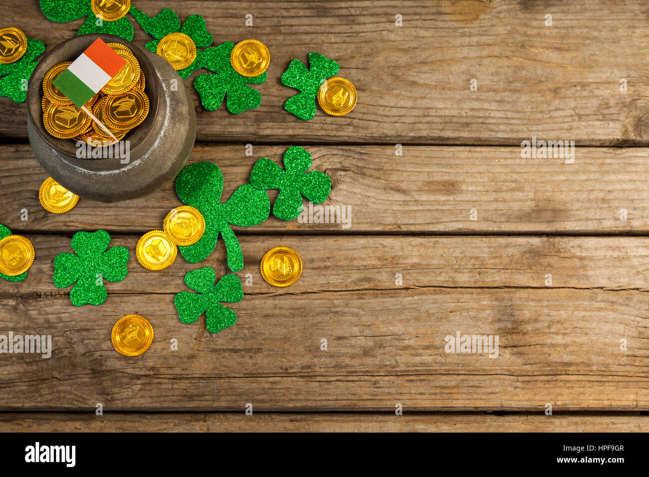 St. Patricks Day pot of chocolate gold coins with irish flag and ...