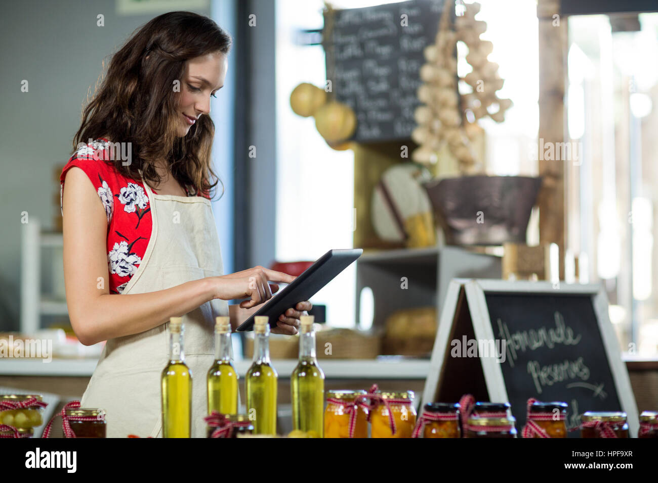 Female shop assistant counter hi-res stock photography and images - Alamy
