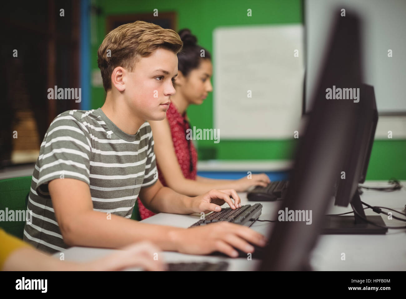 Students studying in computer classroom at school Stock Photo - Alamy