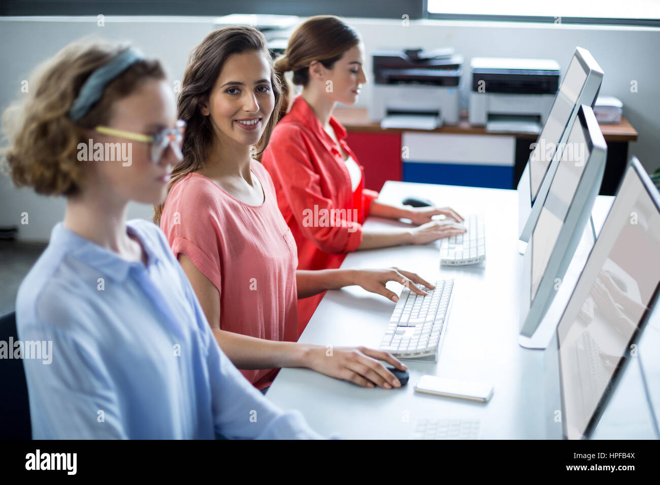 Business executives working on computer in office Stock Photo - Alamy
