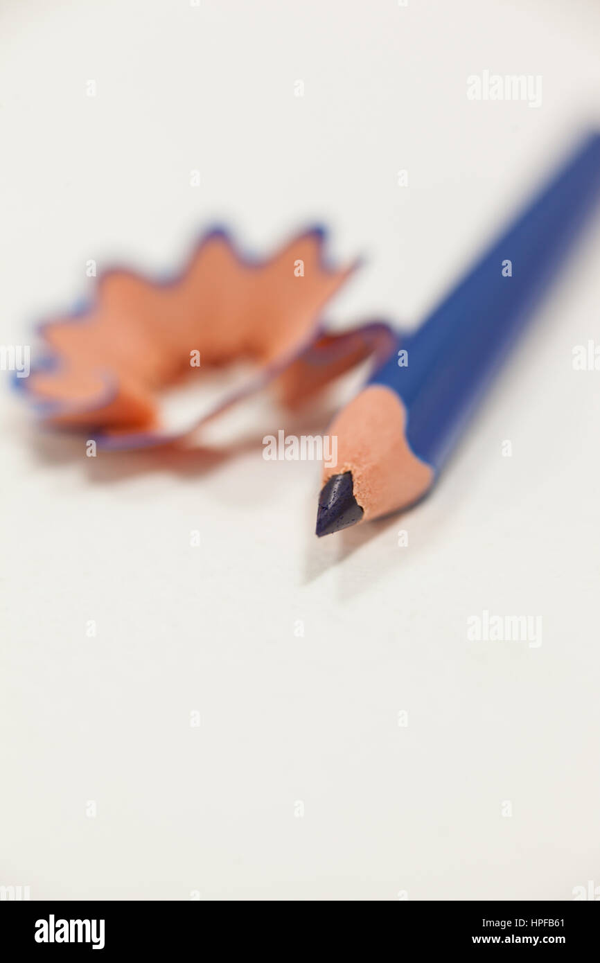Close-up of blue colored pencil with shavings on white background Stock ...