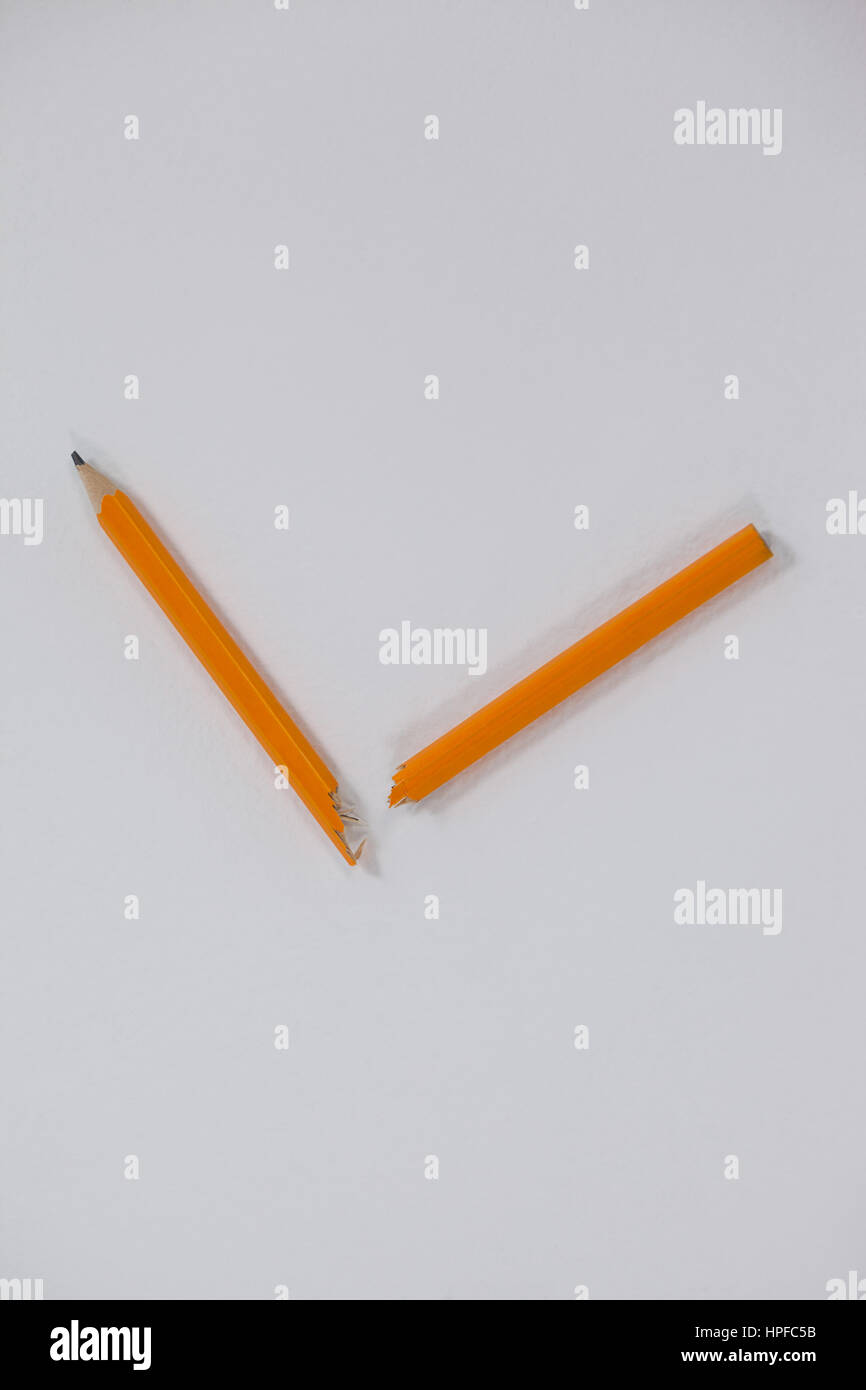 Close-up of broken pencil on white background Stock Photo - Alamy