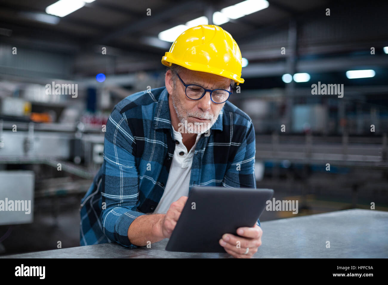 Male factory worker scrolling hi-res stock photography and images - Alamy