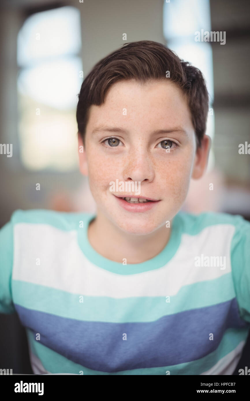 Portrait of smiling schoolboy in classroom at school Stock Photo - Alamy