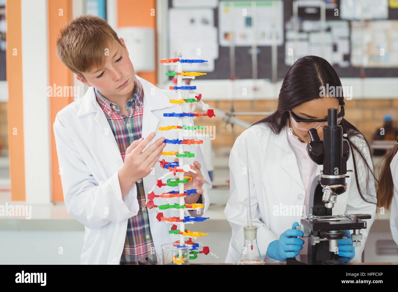 School kids experimenting molecule model in laboratory at school Stock ...