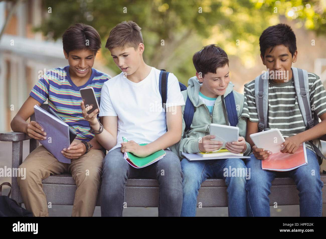 School child reading phone hi-res stock photography and images - Alamy