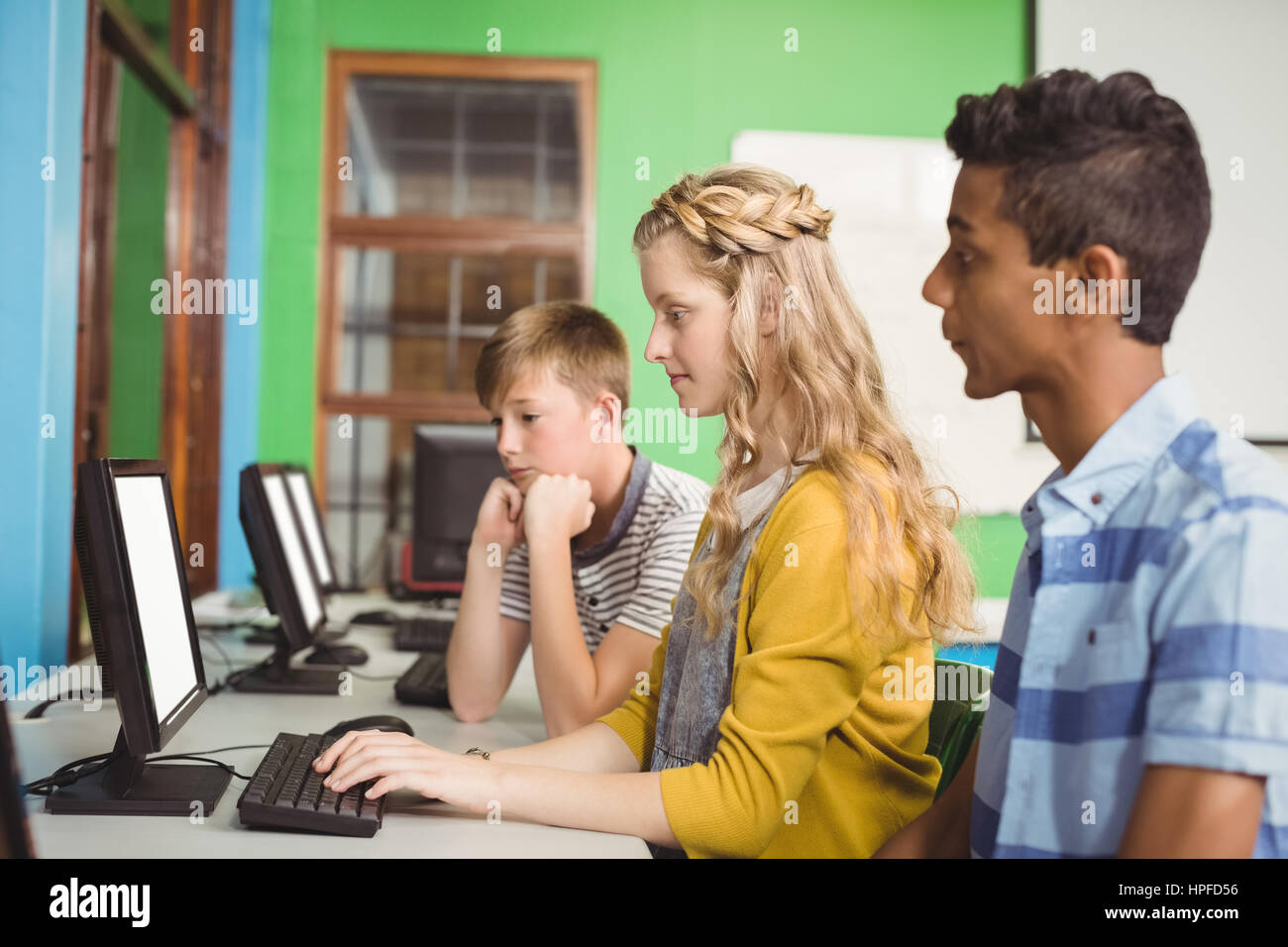 Students studying in computer classroom at school Stock Photo - Alamy