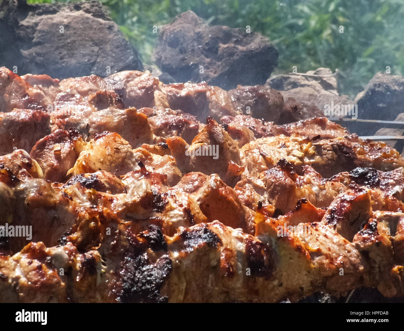 The cooking delicious shish kebabs on fire Stock Photo - Alamy