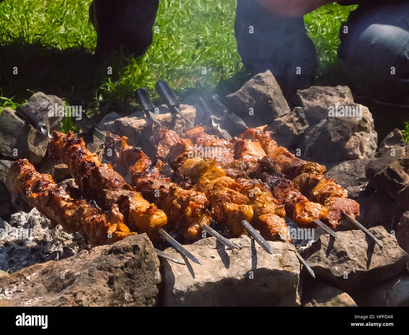 The cooking meat on the coil of the fire Stock Photo - Alamy