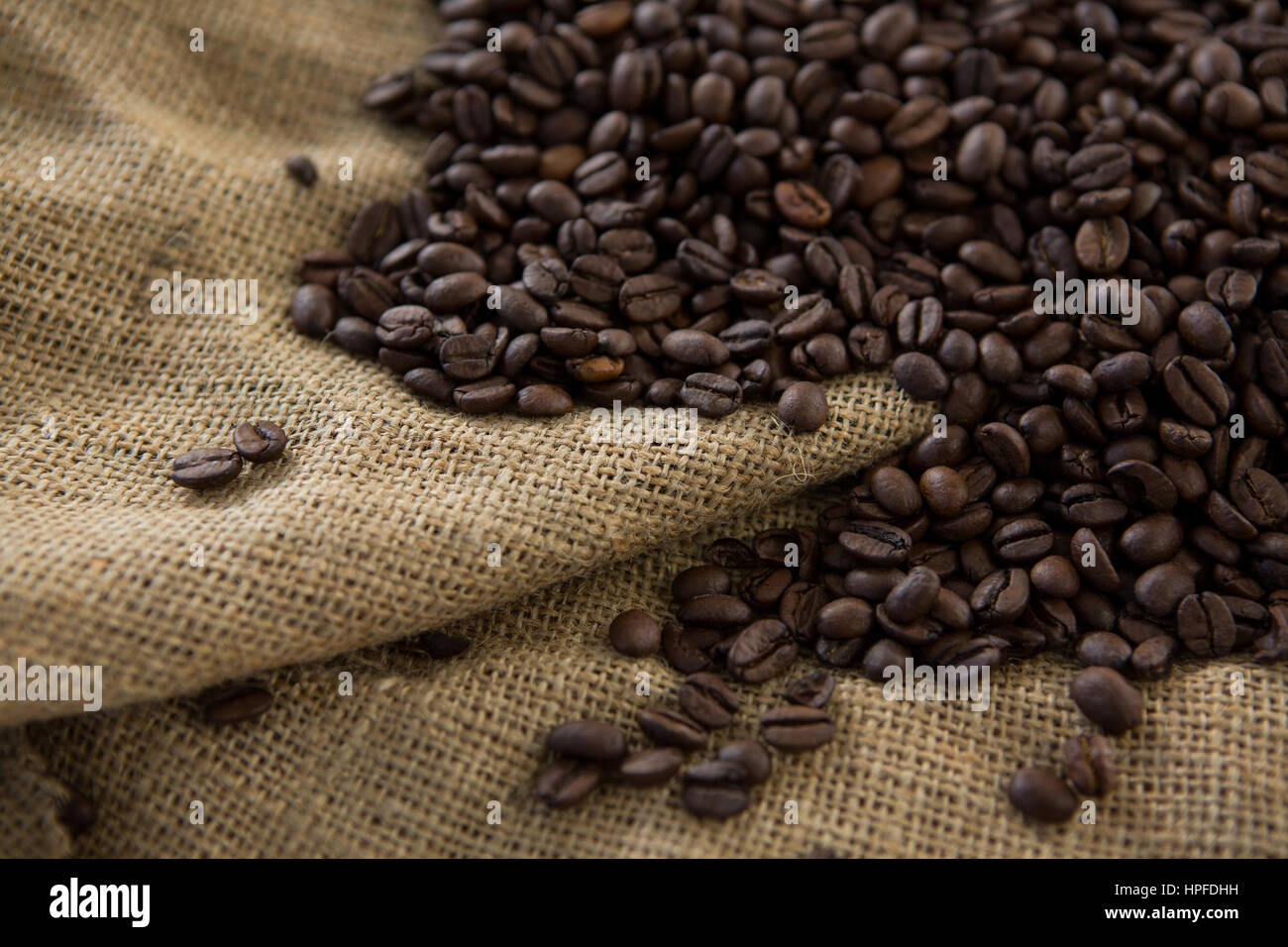 Roasted coffee beans on sack textile Stock Photo - Alamy