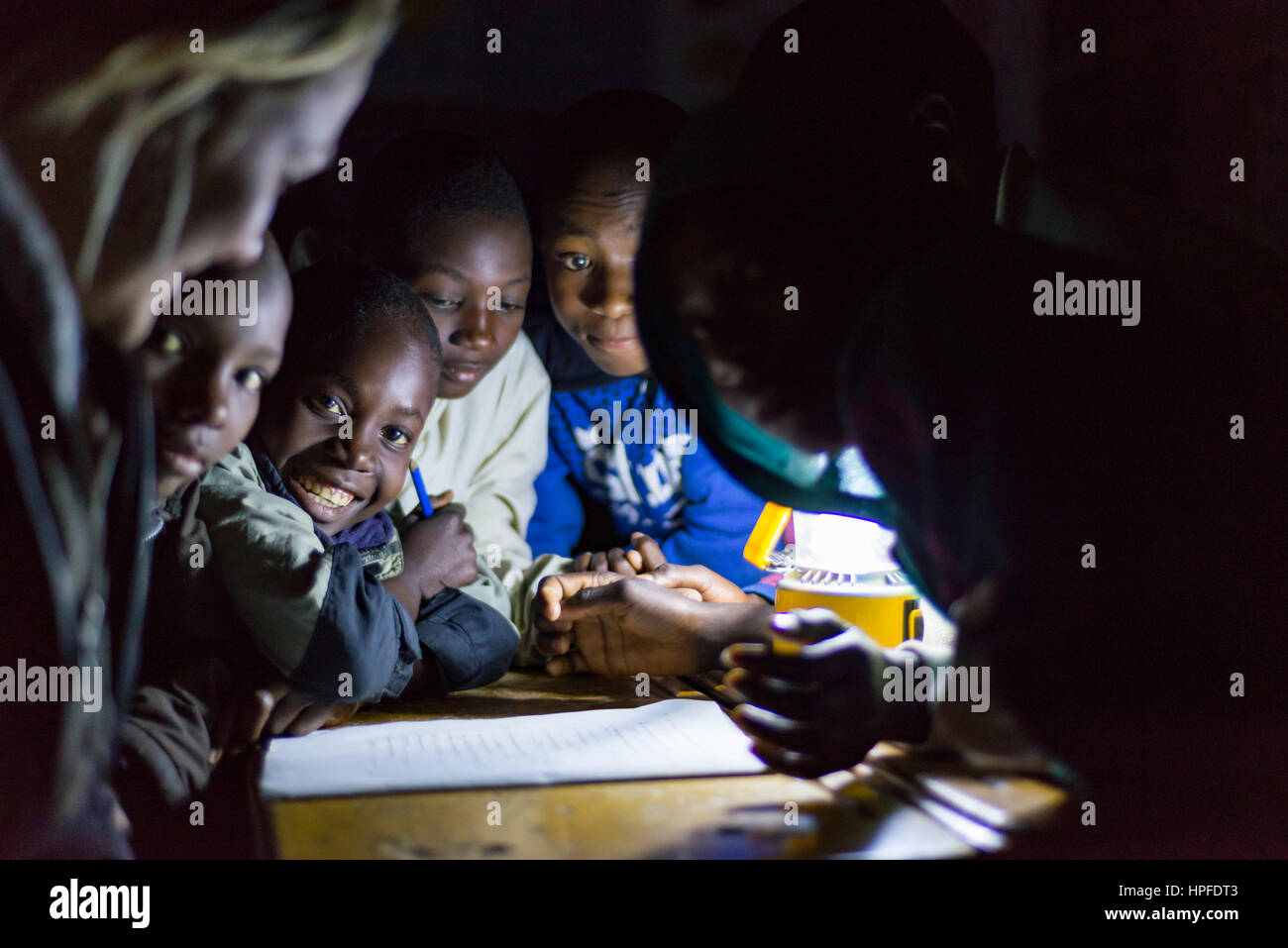 Zimbabwean children learn by torch light in a rural school Stock Photo ...