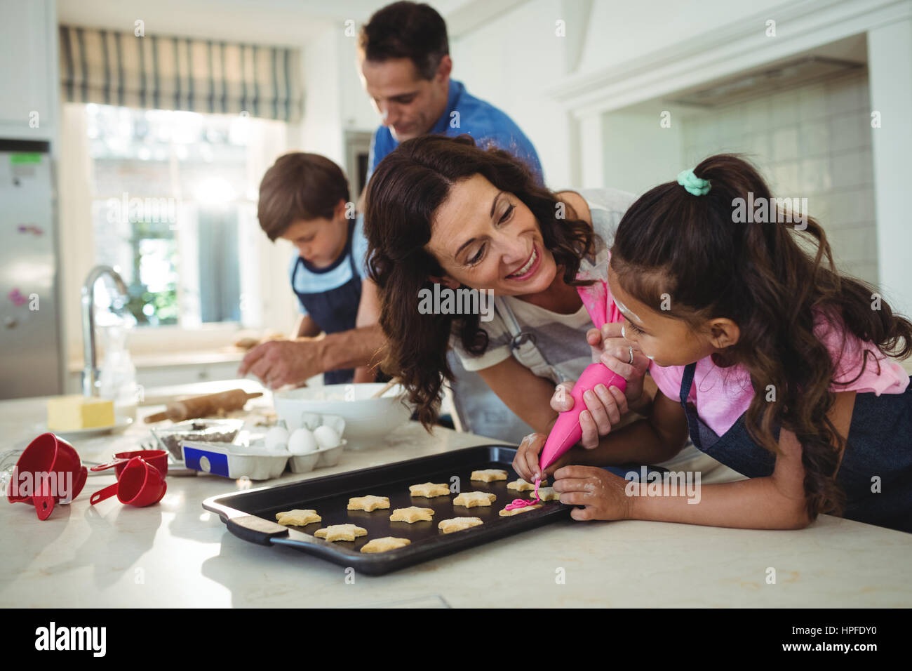 Boy mixing chocolate in kitchen hi-res stock photography and images - Alamy