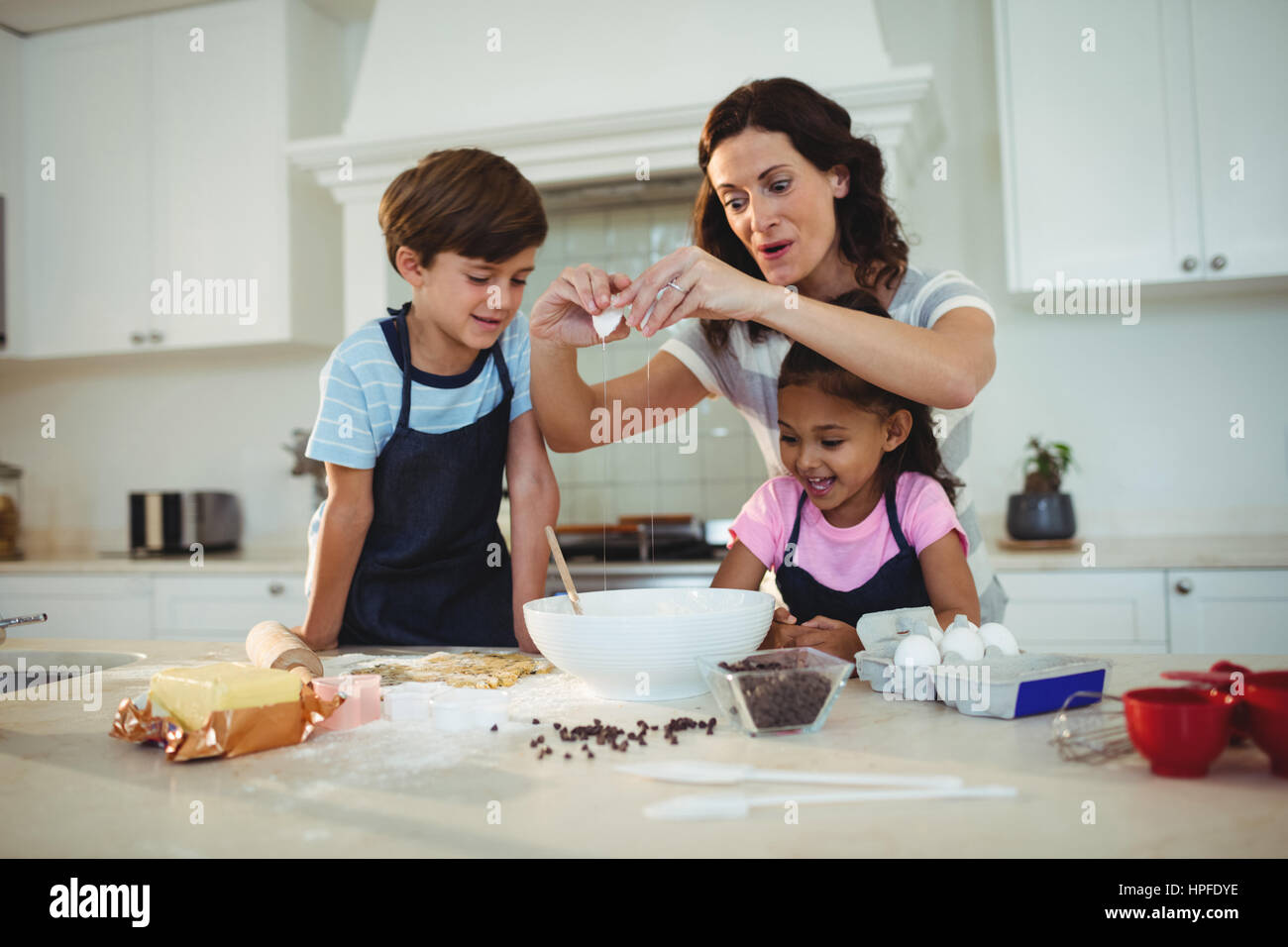 Boy breaking an egg hi-res stock photography and images - Alamy