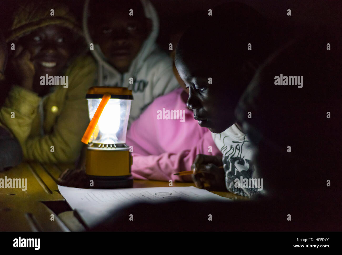 Children reading by torch hi-res stock photography and images - Alamy