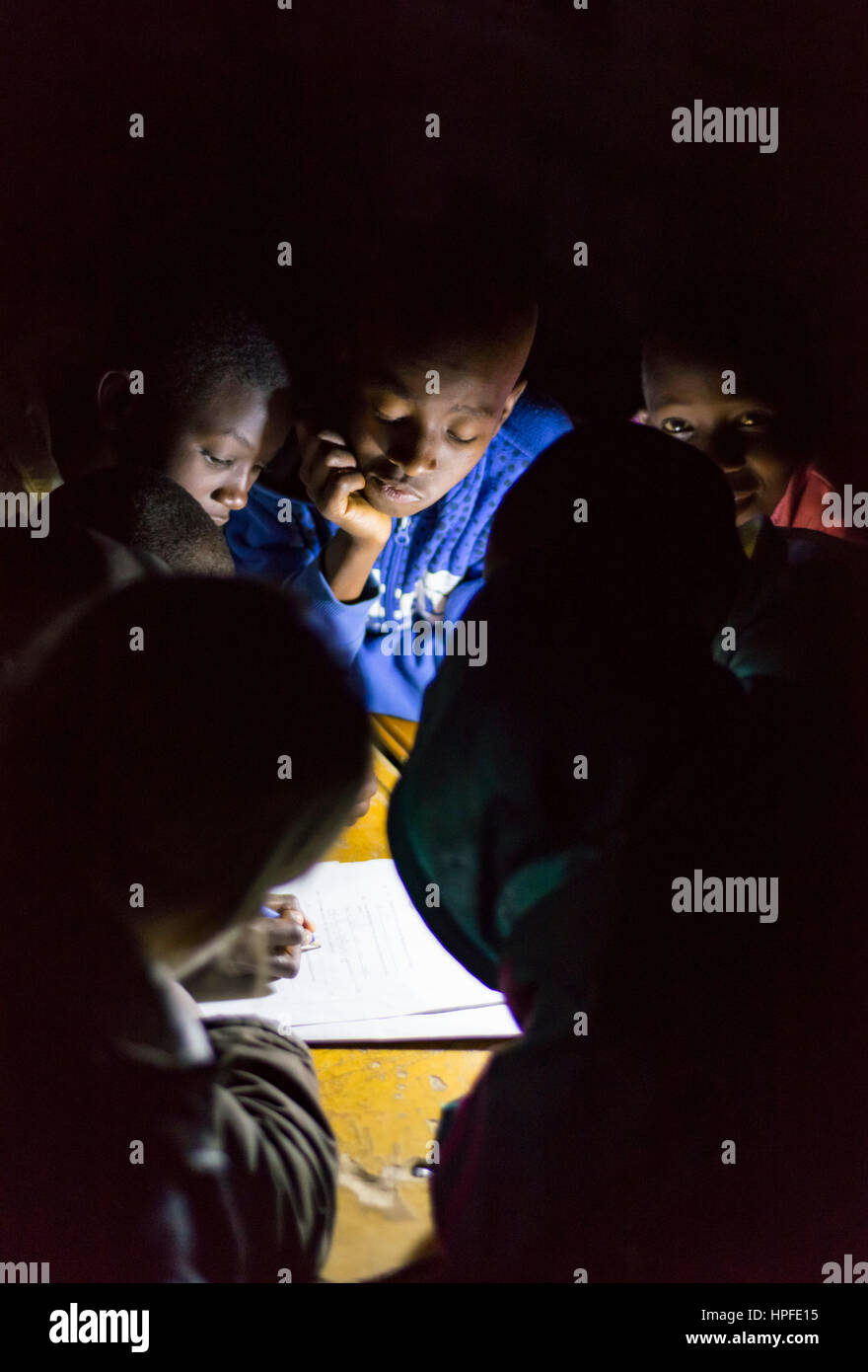 Zimbabwean children learn by torch light in a rural school Stock Photo ...