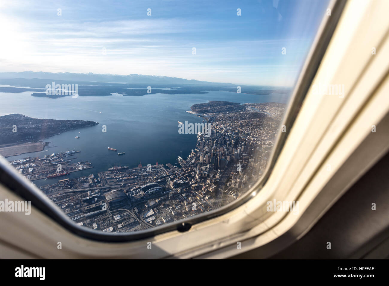 View out an airliner window over Seattle, Washington Stock Photo - Alamy