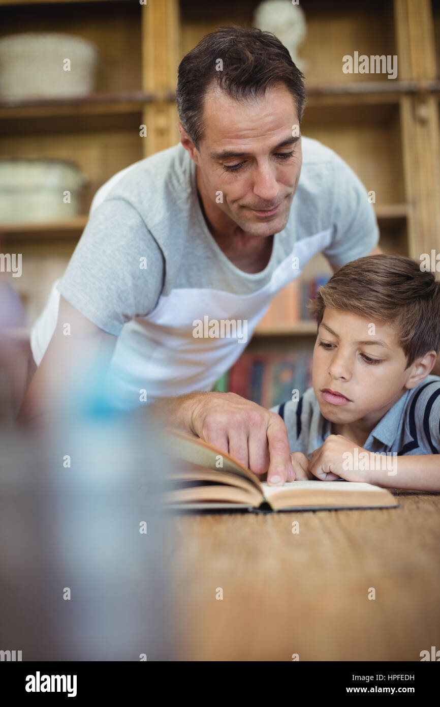 Father and his son reading a book hi-res stock photography and images ...