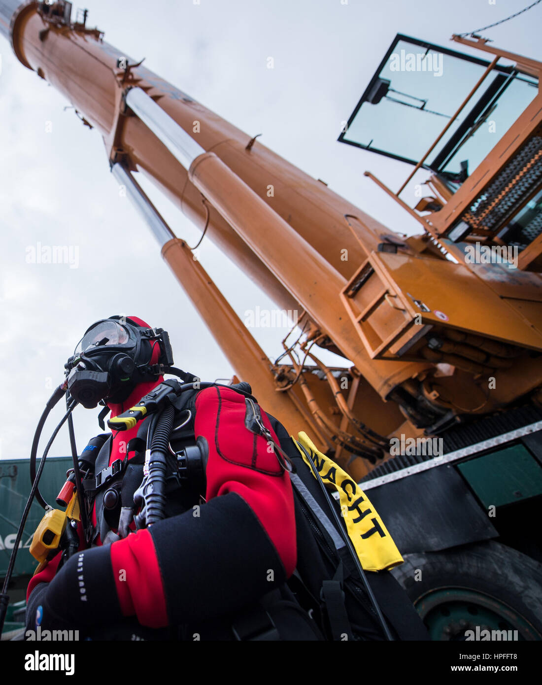 Munich, Germany. 21st Feb, 2017. A diver prepares himself for his work ...