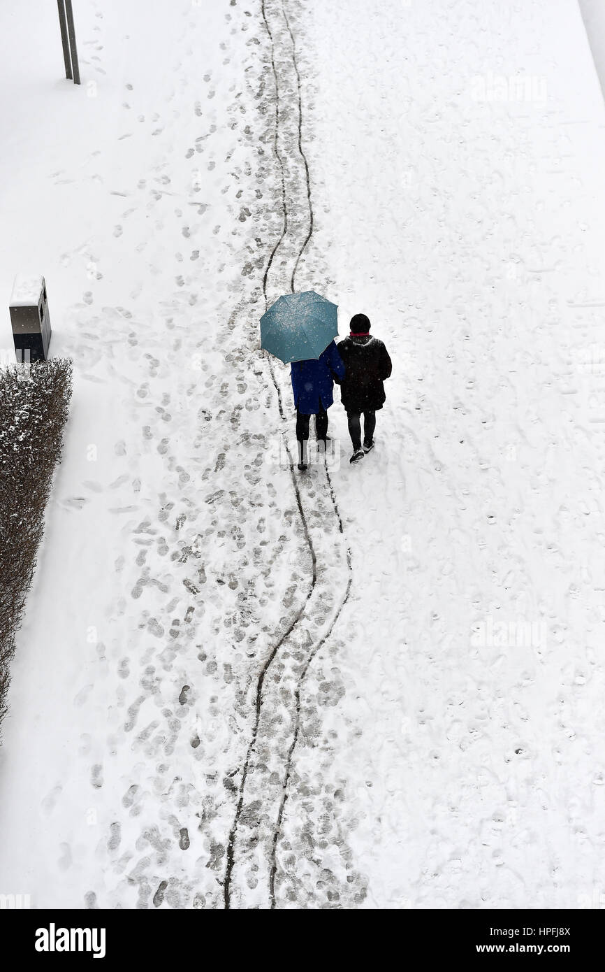 Taiyuan, China's Shanxi Province. 21st Feb, 2017. People walk in snow ...