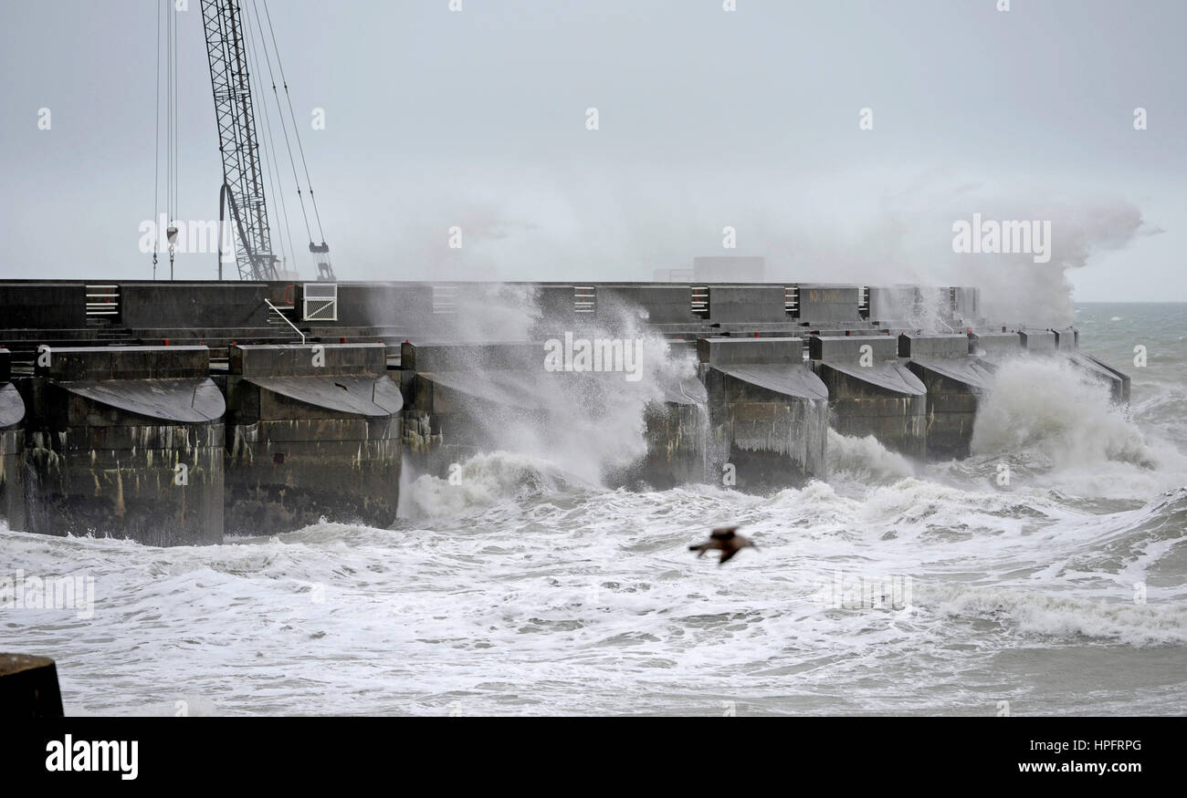 Brighton, UK. 22nd Feb, 2017. Waves crash over the Brighton Marina ...