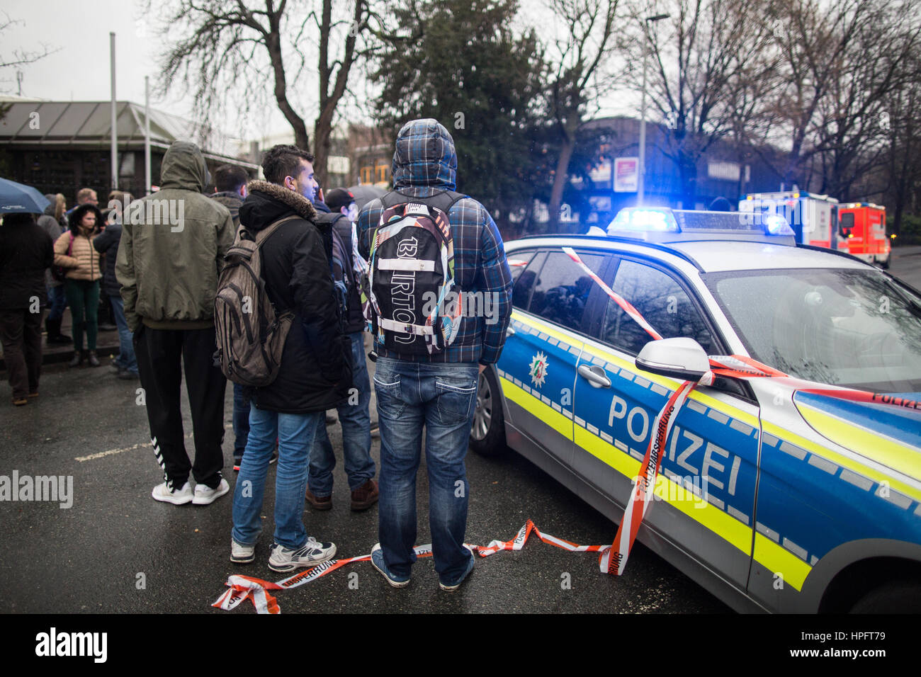 Menden, Germany. 22nd Feb, 2017. Students stand next to a police car in ...