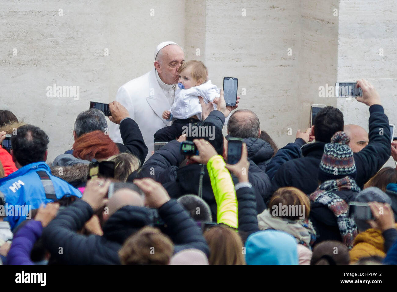 Vatican City, Vatican. 22nd Feb, 2017. Pope Francis kisses a baby as he ...
