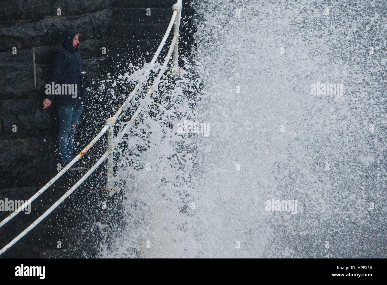 Boy standing sea watching waves hi-res stock photography and images - Alamy