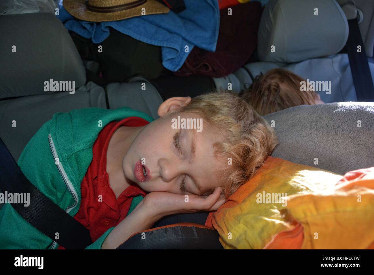 Two children sleep in the full-loaded car Stock Photo - Alamy