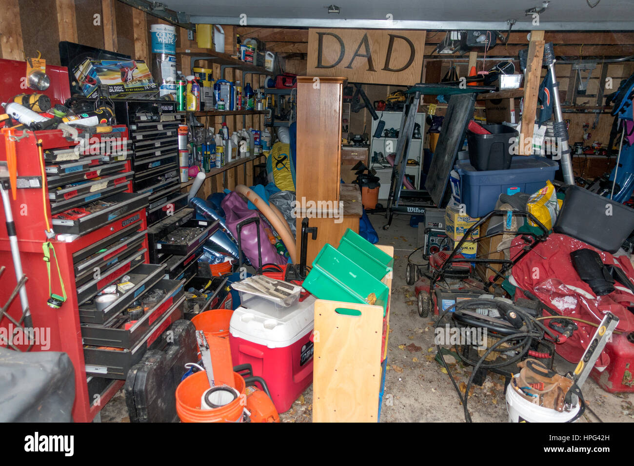 Working man's garage with two tall stacks of cabinets and drawers ...