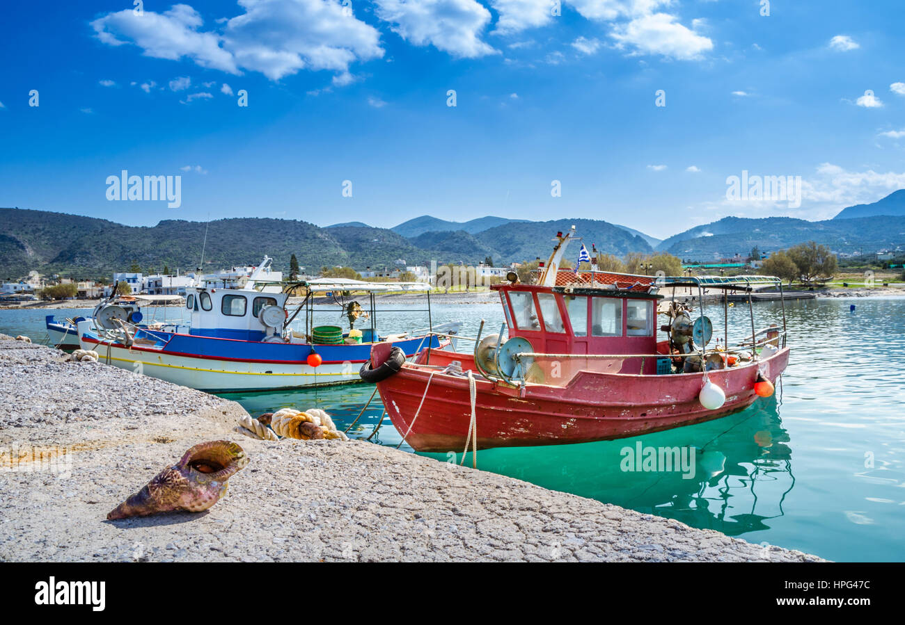 Big shell in front of traditional fishing boats, Crete, Greece Stock ...