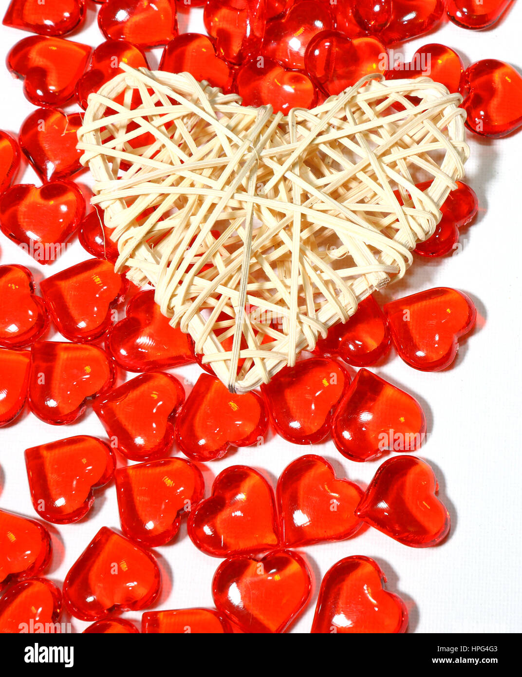 A heart shape with red hearts scattered around Stock Photo - Alamy