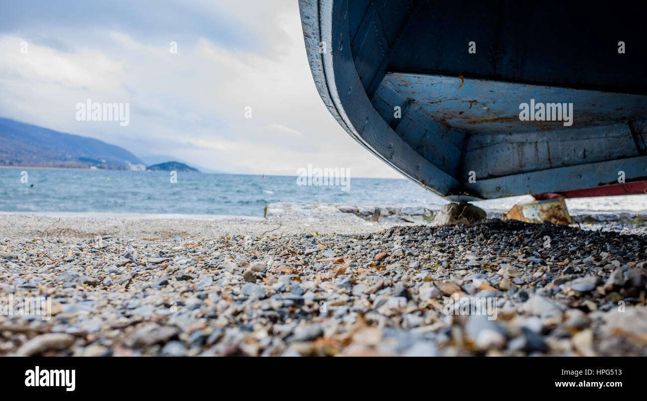 Under the boat Stock Photo - Alamy