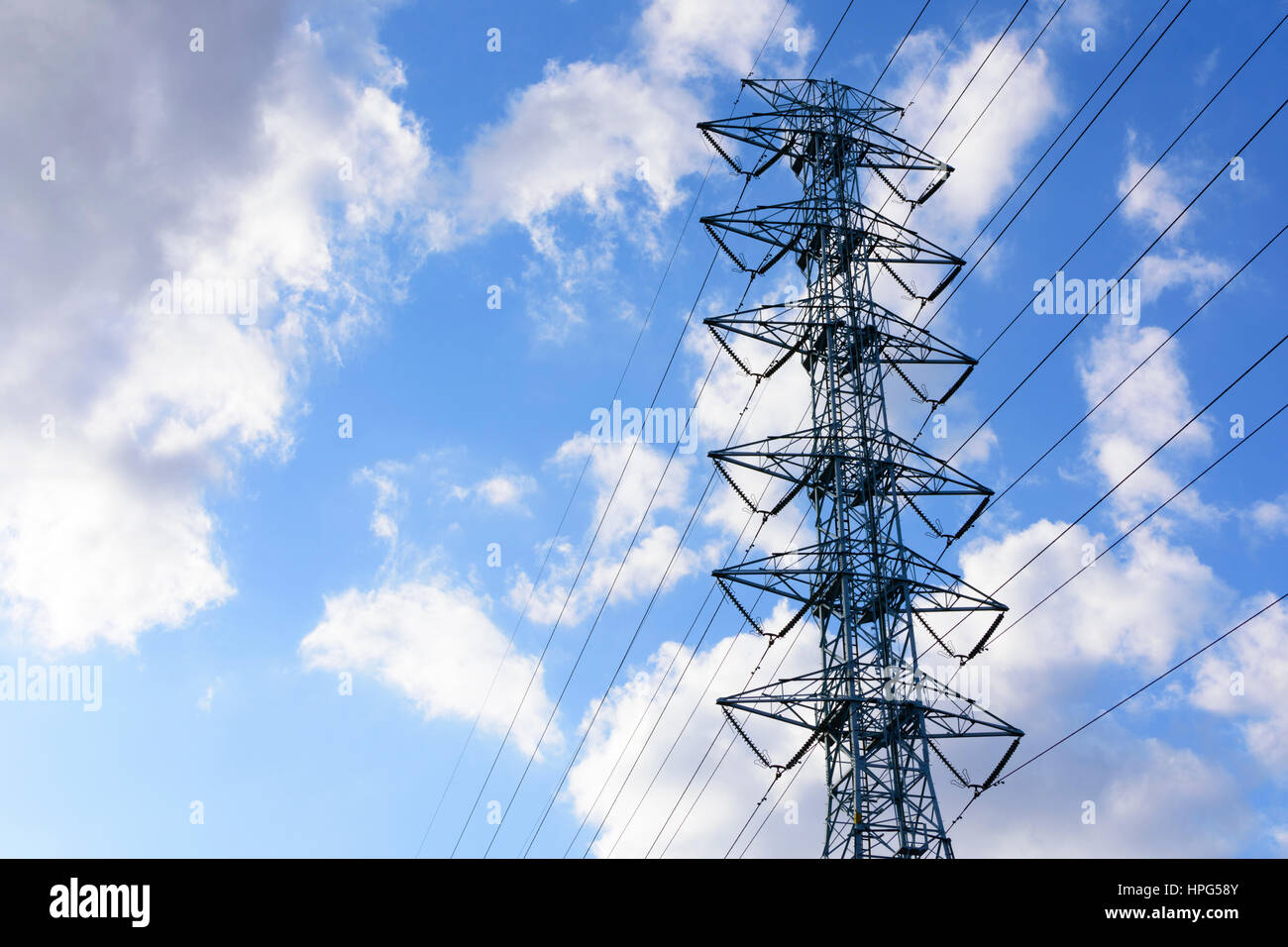 Power transmission tower with clouds as background Stock Photo - Alamy
