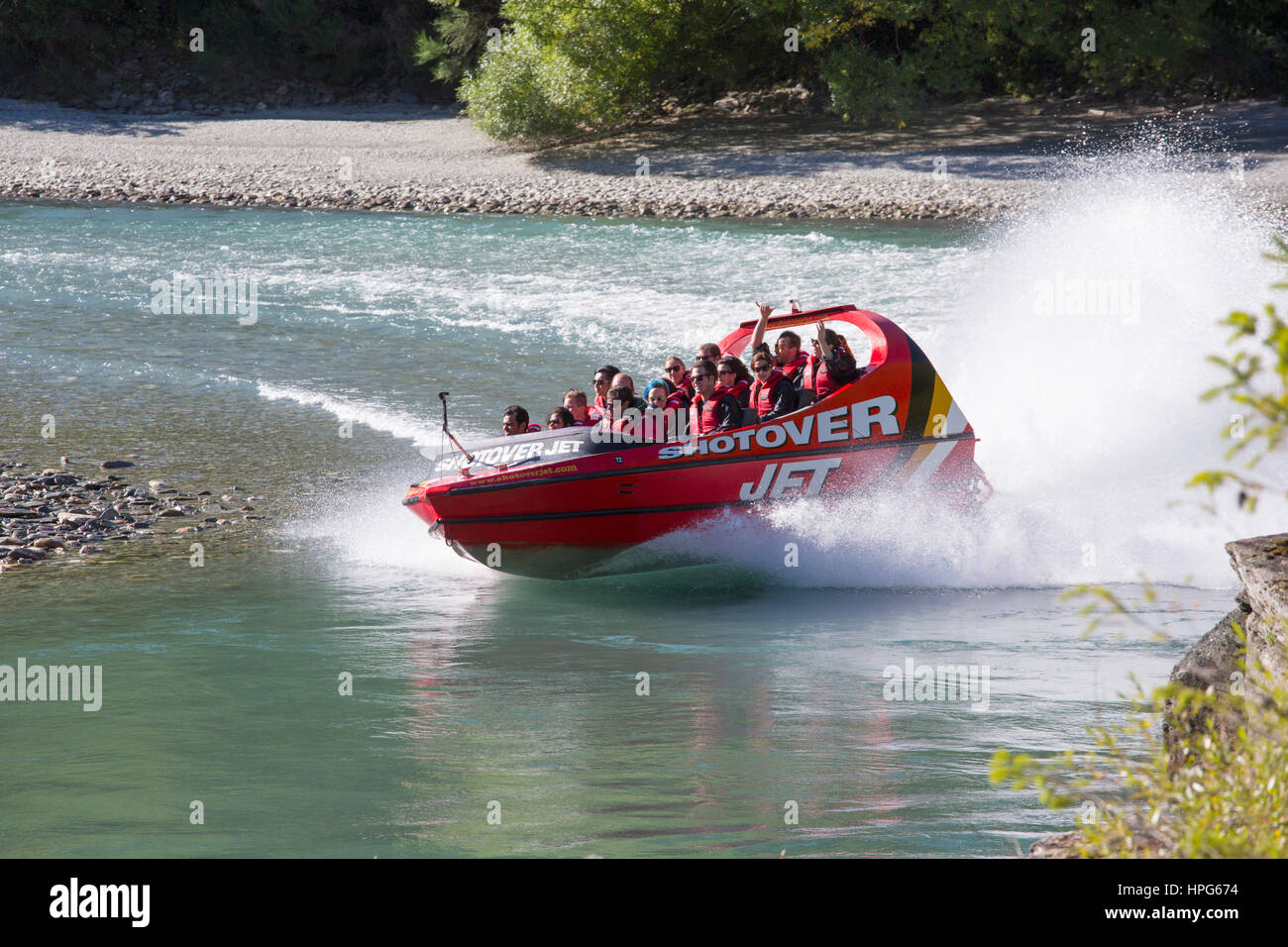 Queenstown, Otago, New Zealand. Shotover Jet boat speeding across the ...