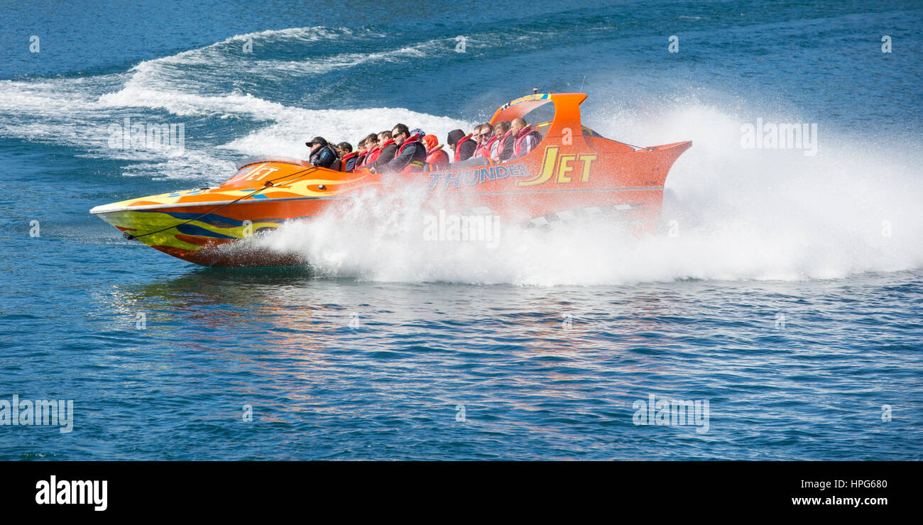 Queenstown, Otago, New Zealand. Thunder Jet boat speeding across ...