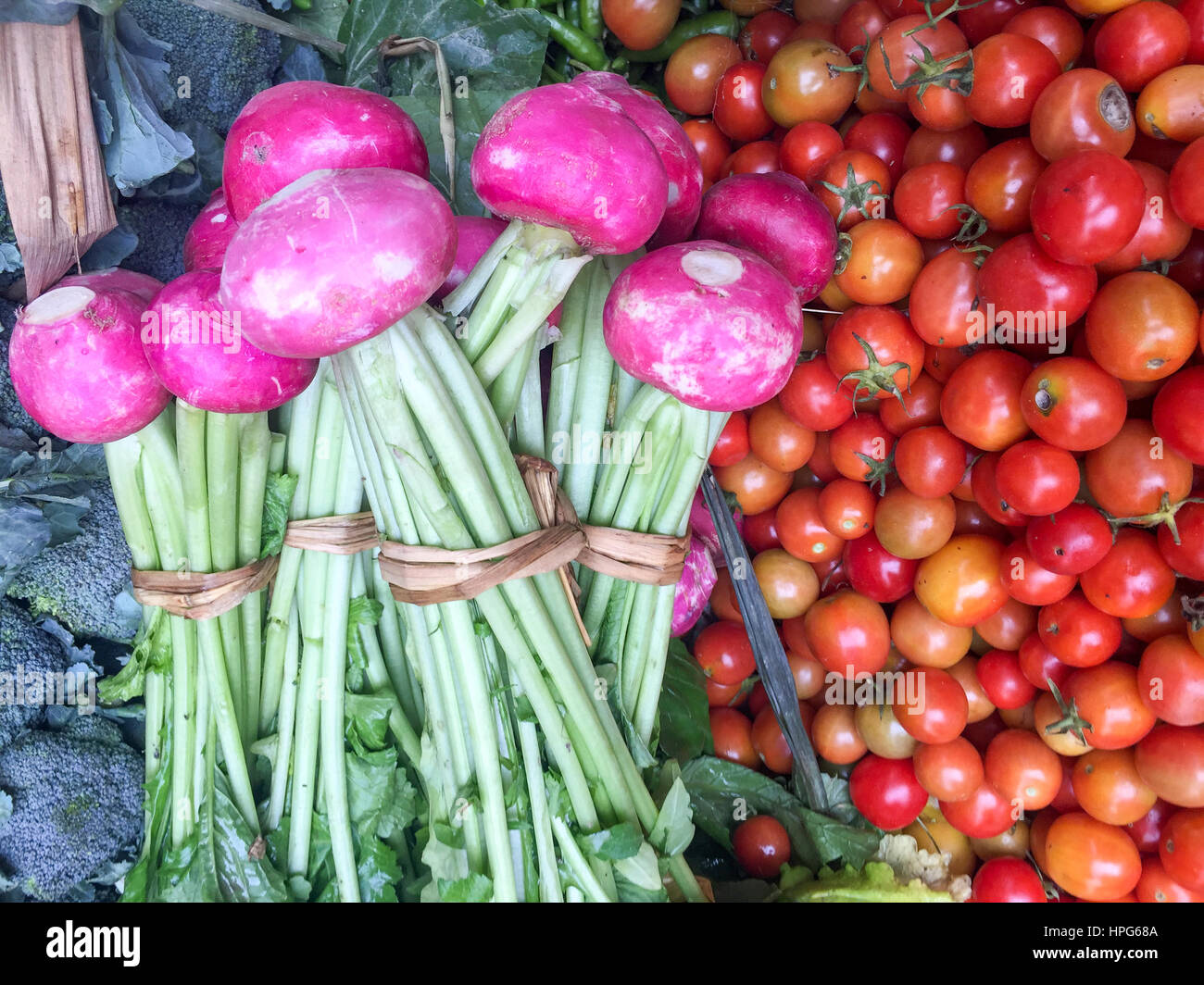 Nepal purple shallots and red tomatoes on market display Stock Photo ...