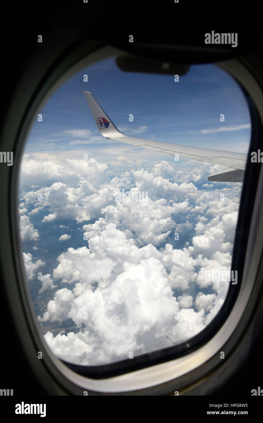 South-East Asia, Malaysia, view of a plane wing through a plane window ...