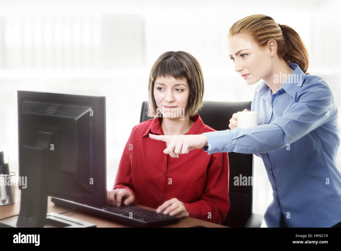 two work colleagues working together in the office Stock Photo - Alamy