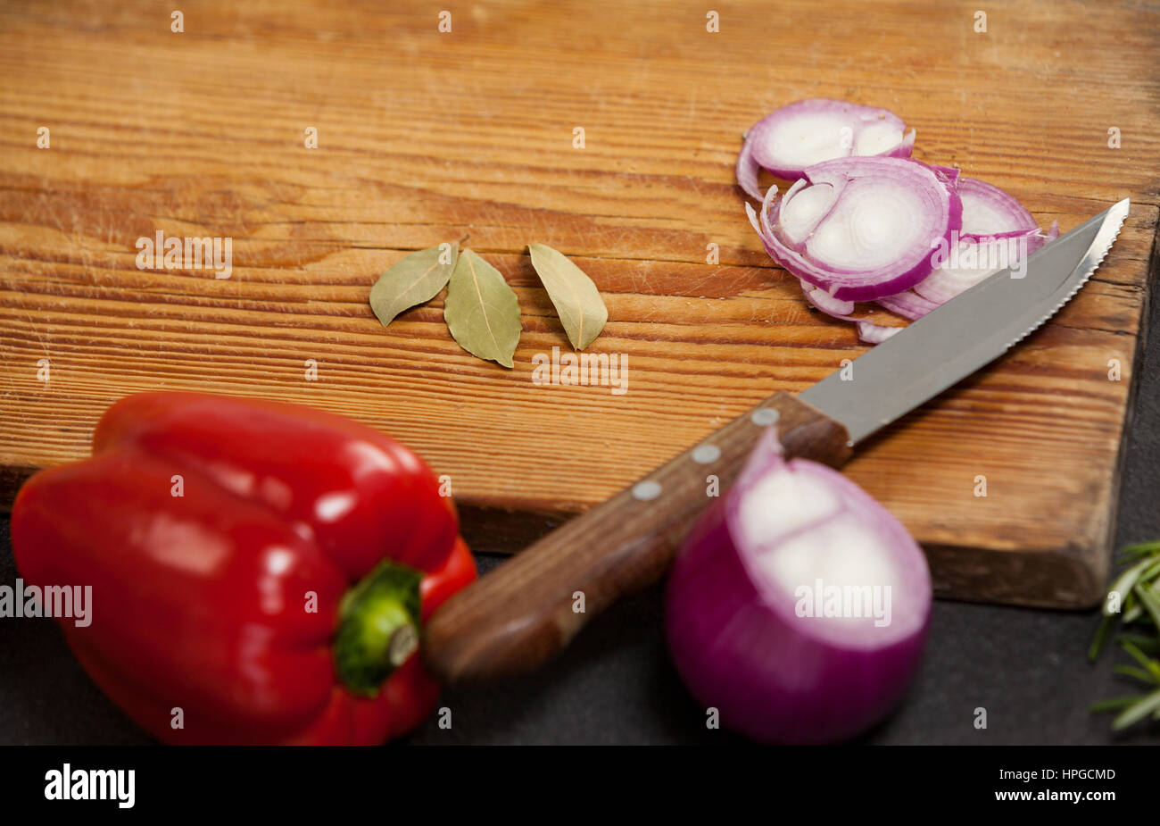 Wooden tray with ingredients against black background Stock Photo - Alamy