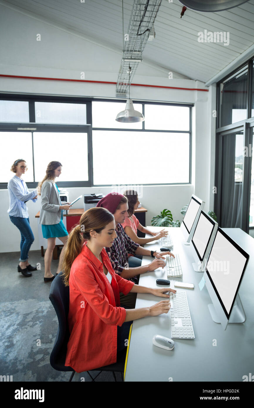 Business executives working on computer in office Stock Photo - Alamy