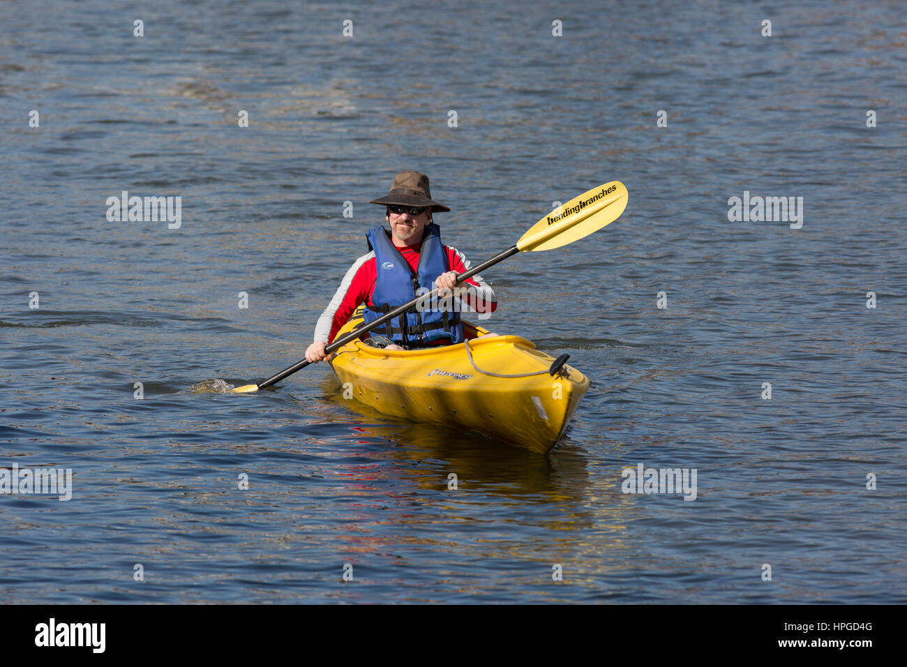 Man kayaking on a river Stock Photo - Alamy