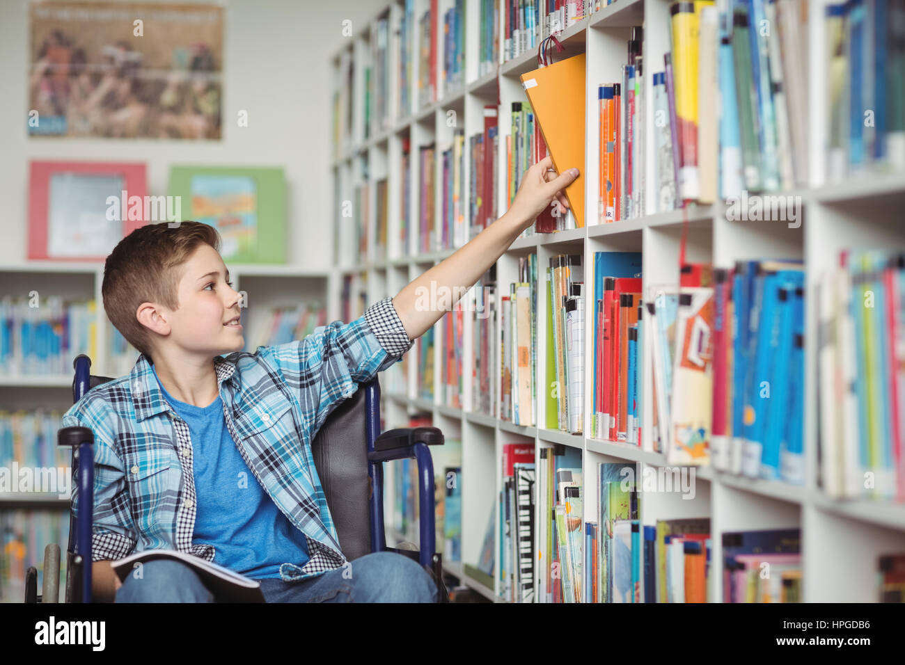 Disabled schoolboy selecting book in library at school Stock Photo - Alamy Disabled schoolboy selecting book in library at school Stock Photo - Alamy