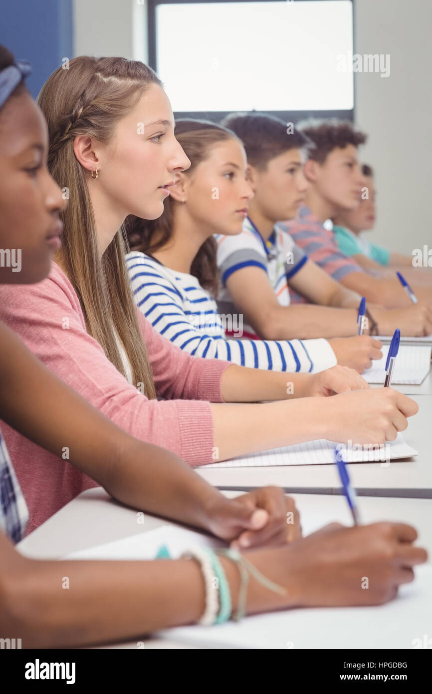 Students studying in classroom at school Stock Photo - Alamy