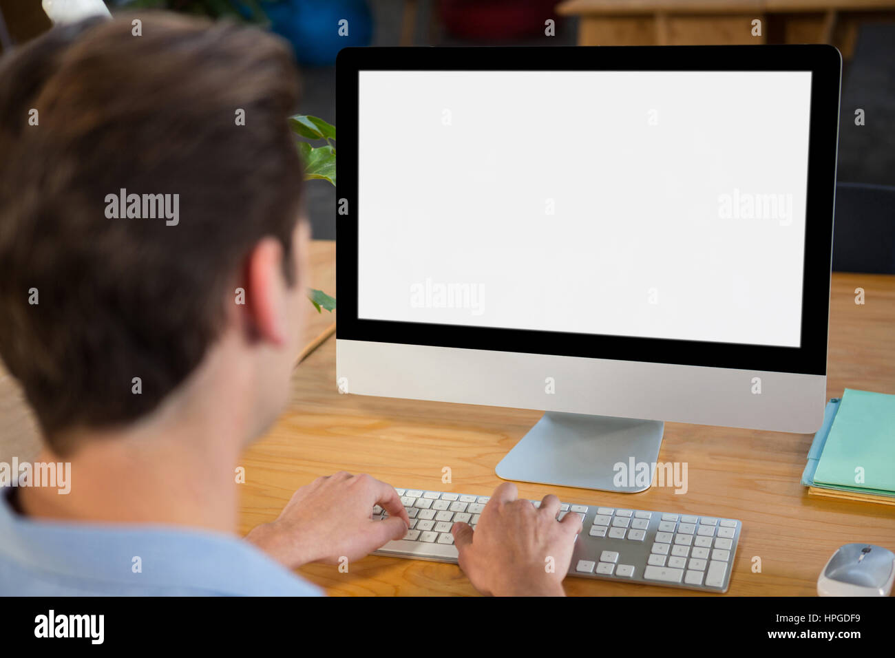 Rear view of graphic designer using desktop pc Stock Photo - Alamy