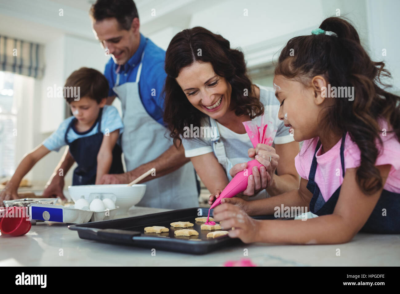 Boy mixing chocolate in kitchen hi-res stock photography and images - Alamy
