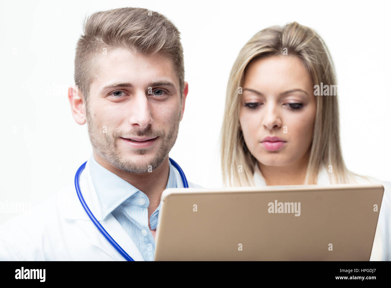 doctors discussing about exam's data looking at a digital tablet screen ...