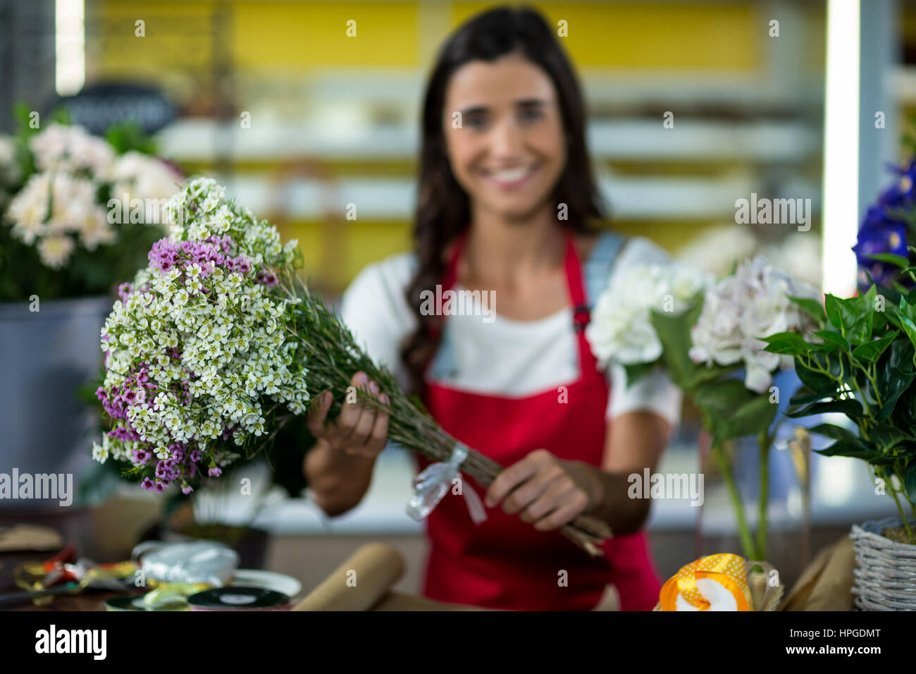 Florist offering flowers at the counter in the florist shop Stock Photo ...