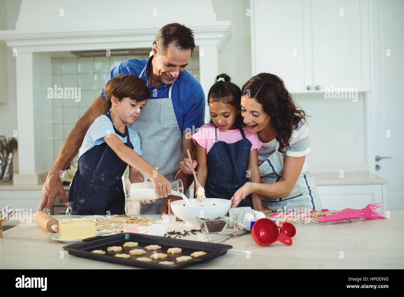 Boy mixing chocolate in kitchen hi-res stock photography and images - Alamy